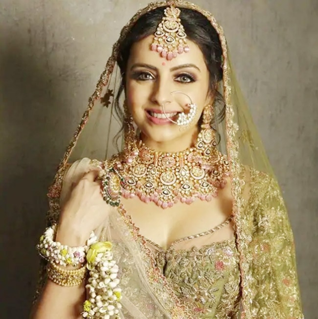 Shrenu Parikh flaunts her radiant smile as she is dressed as a bride
