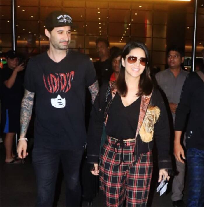 Sunny Leone, Daniel Weber Walk Hand in Hand at Mumbai Airport