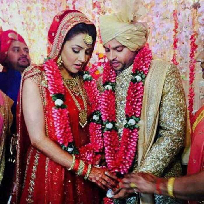 Harbhajan Singh poses with wife Geeta Basra during their wedding function
