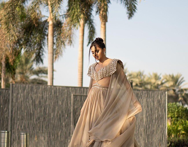 Tejasswi Prakash wore a golden cut out gown