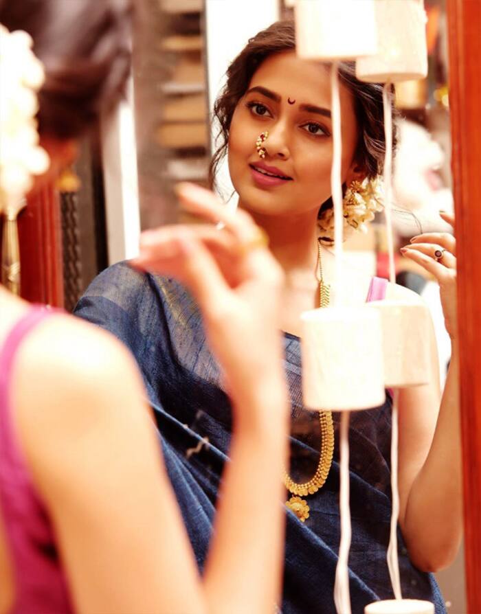 Tejasswi Prakash can be seen clad in a blue saree