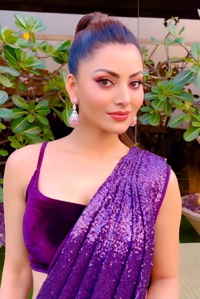 Urvashi Rautela drops her pallu in a glamorous purple saree