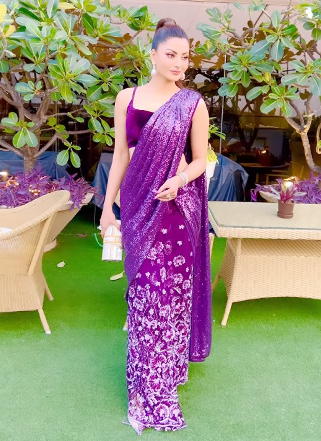 Urvashi Rautela drops her pallu in a glamorous purple saree